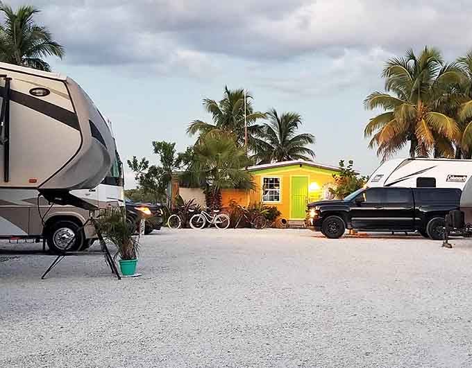 RV living meets tropical dreams where citrus-hued cottages welcome road warriors seeking waterfront serenity and good neighbors.