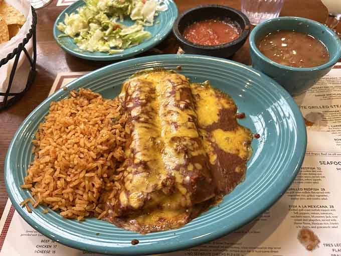 Golden enchiladas blanketed in cheese with fluffy Mexican rice, this is comfort food that actually comforts your soul.