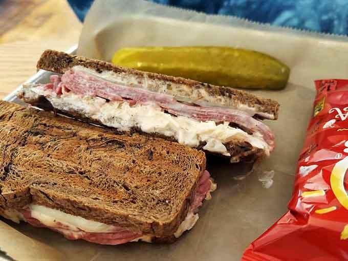 This Reuben is stacked so generously it requires both hands and possibly a structural engineer to navigate properly.