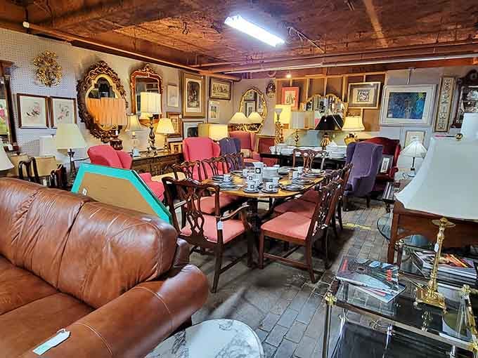 That leather sofa has seen more dinner parties than your entire friend group combined, and it's still going strong.