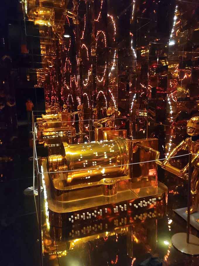 Golden reflections multiply into infinity, creating a hall of mirrors that would make Liberace weep.