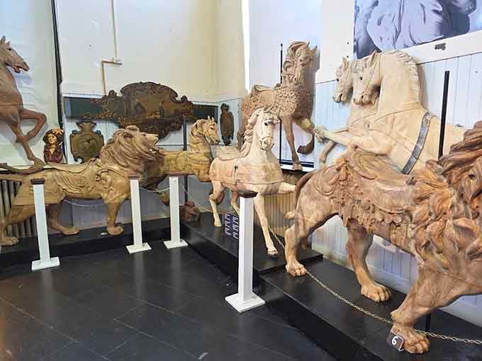 Raw wood reveals the artisan's vision, each chisel mark a step toward carousel magic.