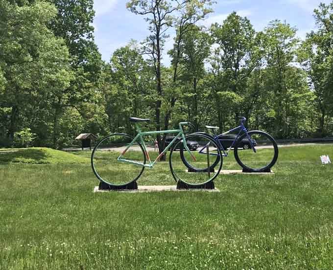 Colorful bike sculptures add whimsy to the park grounds, proving art and nature make excellent neighbors here.