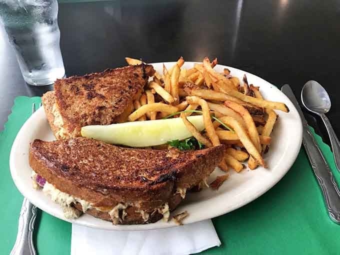 Golden-griddled bread embracing melted cheese and tuna &ndash; comfort food that never goes out of style.