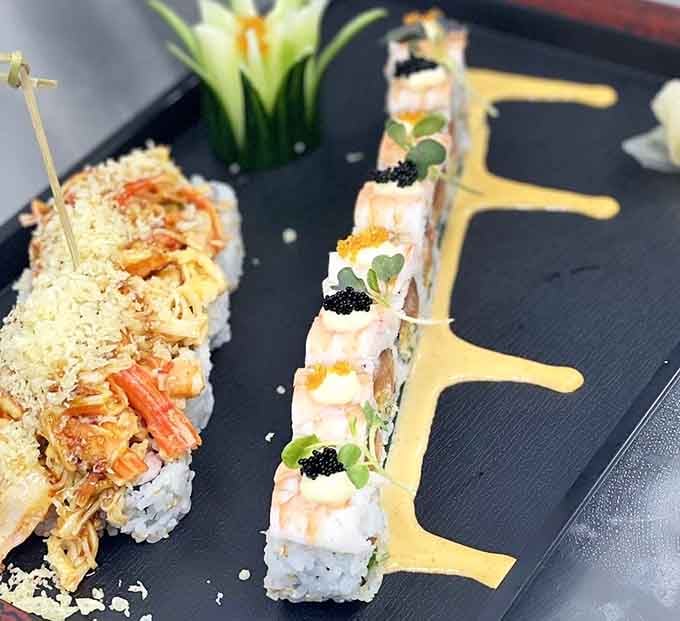 Artfully presented sushi that looks too pretty to eat, but you're paying for unlimited so dive in anyway, friend.