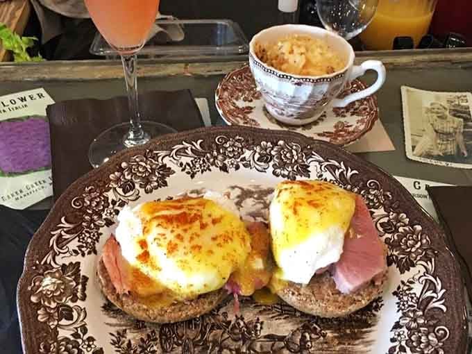 Those perfectly poached eggs sitting atop English muffins are basically edible sunshine, and that hollandaise knows what it's doing.