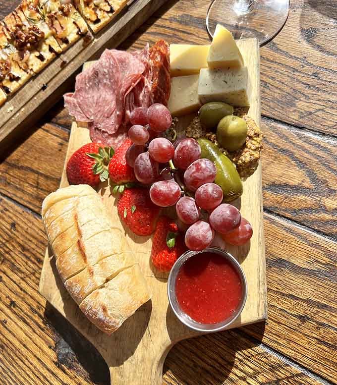 This charcuterie board looks like it raided the best parts of an Italian deli and came back victorious.