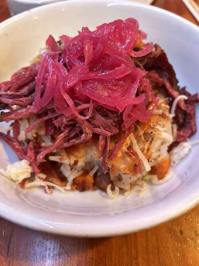 Corned beef hash topped with pickled onions that'll make you rethink everything you thought you knew about breakfast.