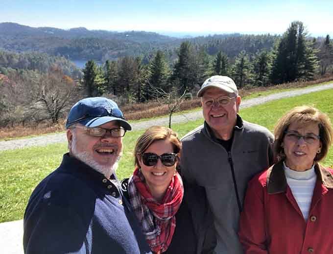 Nothing says "we made it" quite like posing in front of mountain vistas that look Photoshopped.