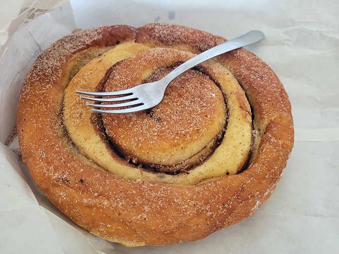 This cinnamon coffee roll spirals into pure breakfast bliss, dusted with enough sugar to make your dentist nervous and happy.