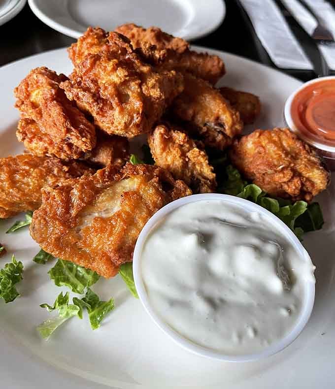 Golden, crispy perfection with a side of ranch that'll make you forget every chain restaurant you've ever visited.