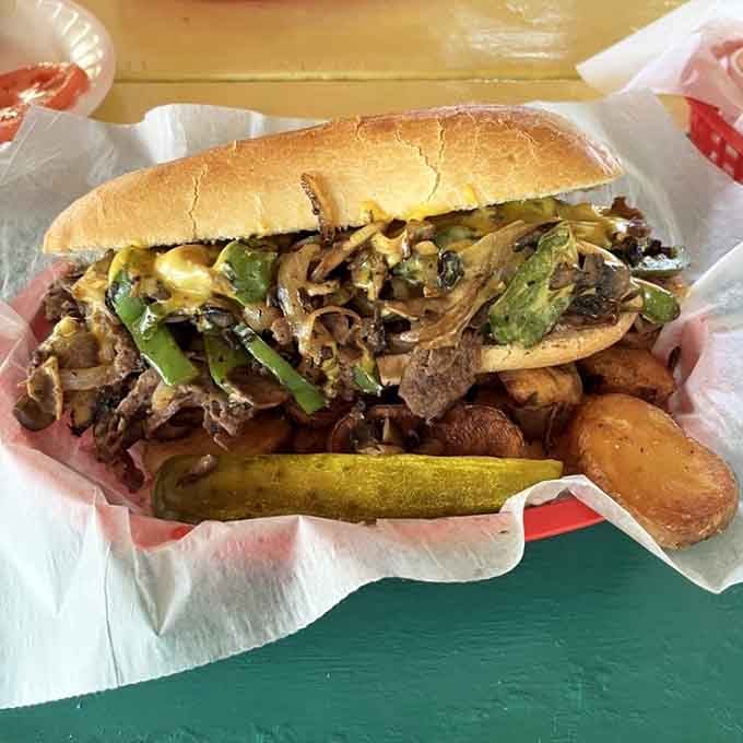 This Philly cheesesteak loaded with peppers and onions proves that even landlocked classics thrive in tropical paradise settings.