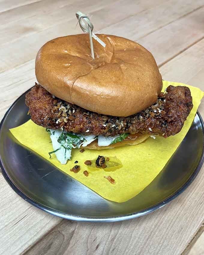 This fried chicken sandwich doesn't mess around, stacking crispy perfection with slaw that actually earns its place.