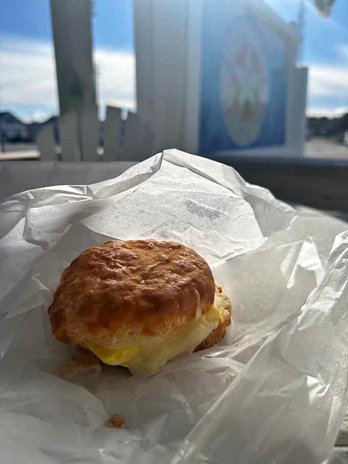 Golden, flaky perfection wrapped in paper, this breakfast sandwich looks like it could solve most of life's problems.
