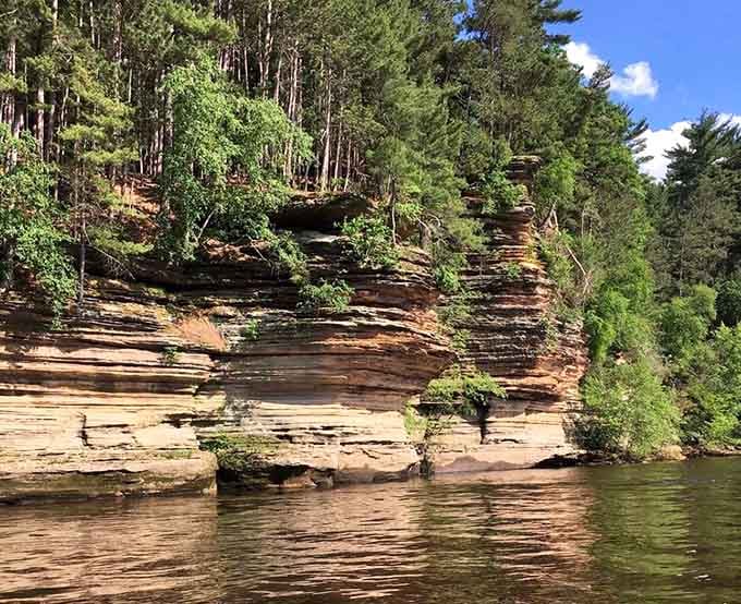 These sandstone cliffs have been standing here longer than anyone's been making cheese, and they're still showing off.