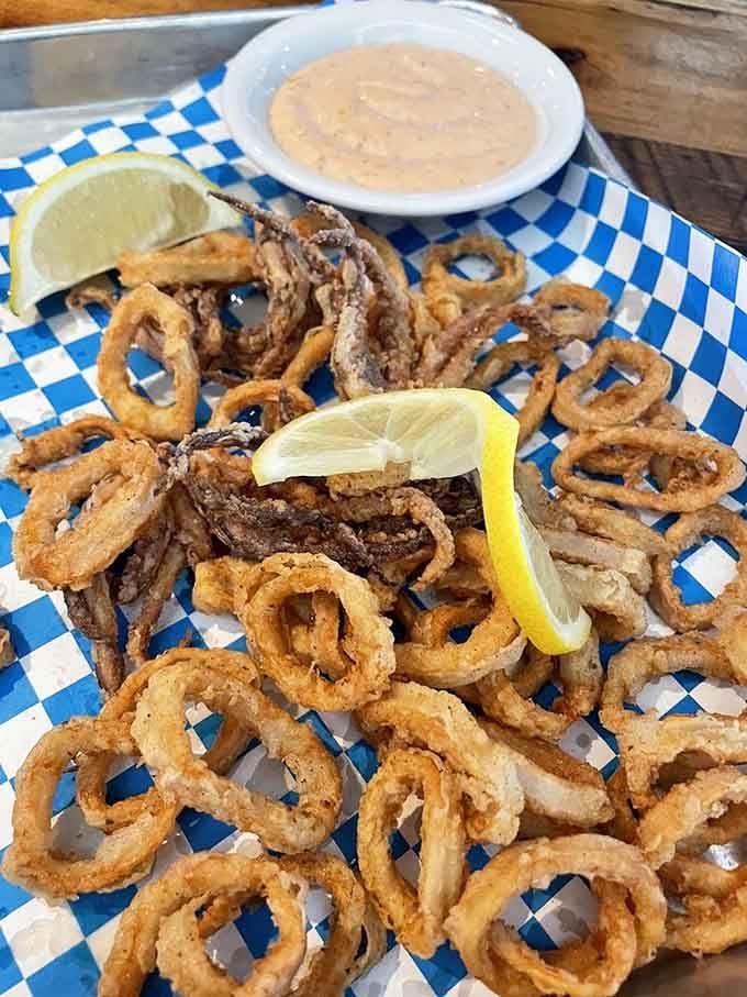 Golden calamari rings that would make any ancient sea creature jealous of their perfect crunch.