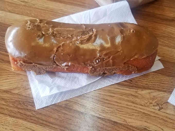 Behold the maple bar in all its golden glory, glistening with that legendary frosting everyone raves about.