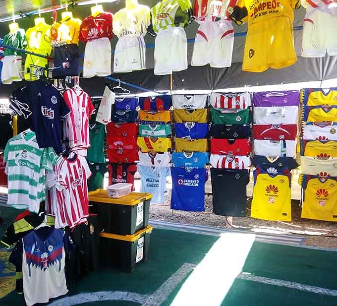 Soccer jerseys from around the world transform this booth into an international sports fan's paradise.