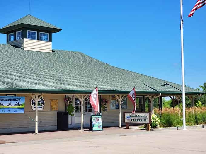 The tourist center's green roof and rustic charm welcome visitors seeking stories about the big guy and his ox.