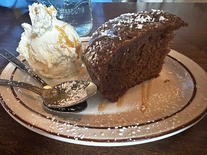 Sticky toffee pudding with vanilla ice cream melting into that sweet sauce is pure British comfort on a plate.