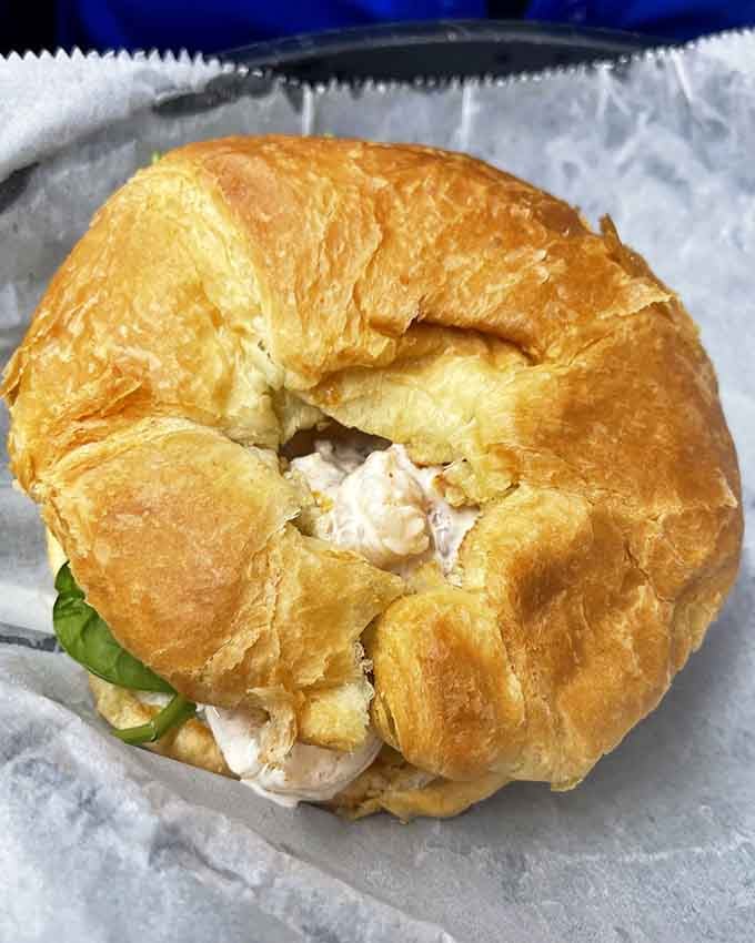 Golden, flaky croissant meets tender shrimp in a combination that'll make you rethink everything about seafood sandwiches.
