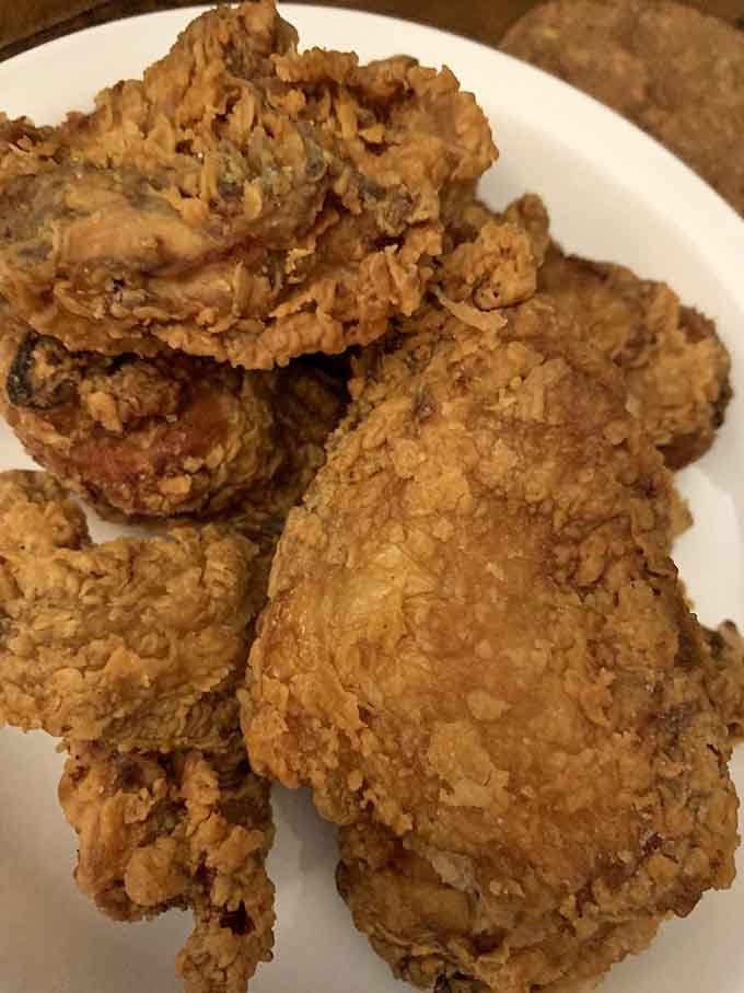 Golden perfection piled high on a plate, each piece crackling with the promise of juicy, tender bliss underneath.