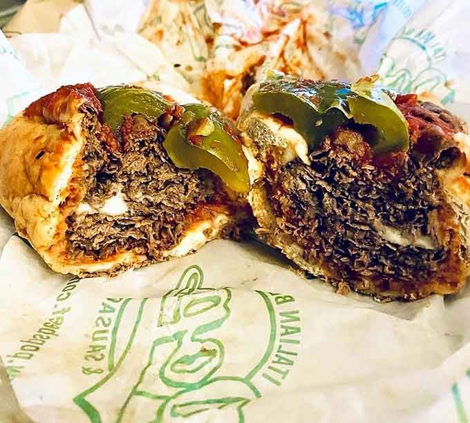 Behold the cross-section of perfection, where tender beef meets sweet peppers in glorious, messy harmony.