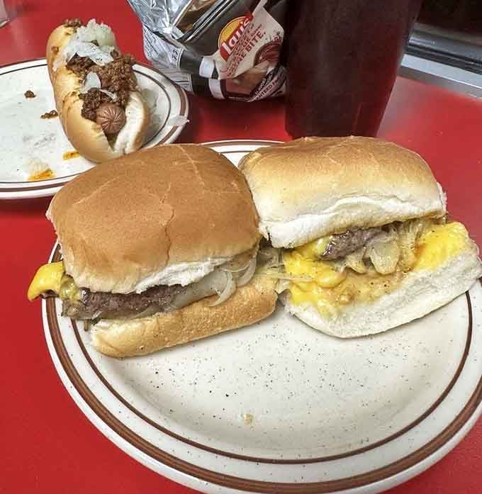 Two perfectly griddled patties with onions and cheese, proving that happiness doesn't require a second mortgage payment.