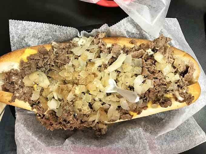 Behold the cheesesteak that laughs in the face of reasonable portion control and wins every time.