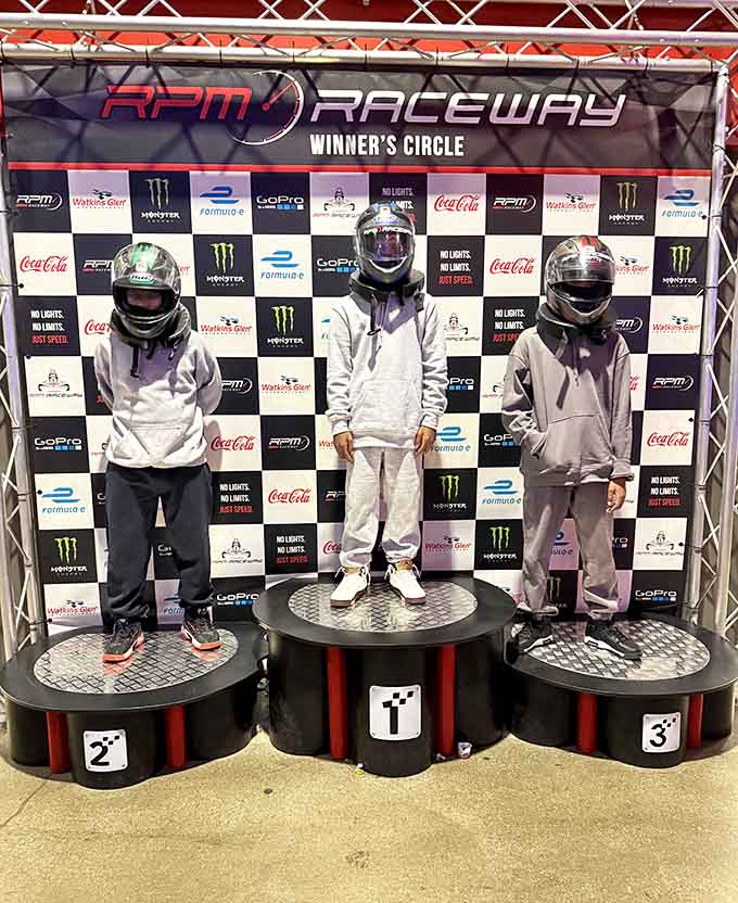 Nothing says "I crushed my friends today" quite like standing on an actual podium with your helmet still on.
