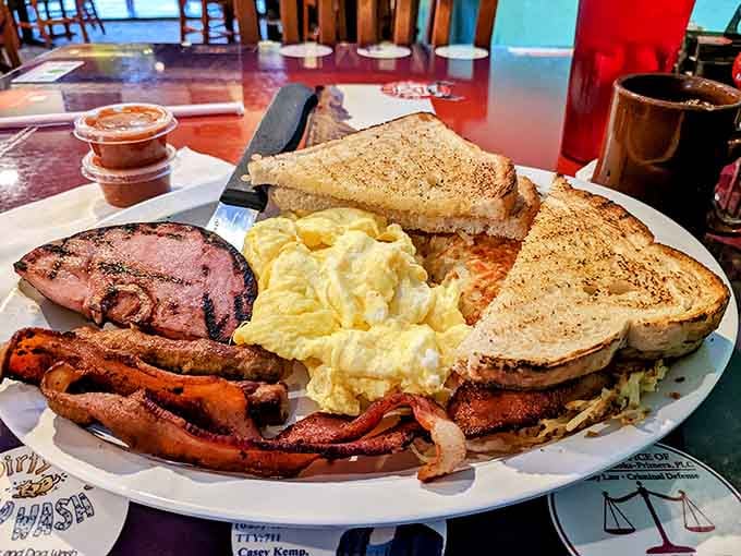 This breakfast plate doesn't mess around, delivering eggs, bacon, sausage, and toast like it's trying to fuel your entire day.