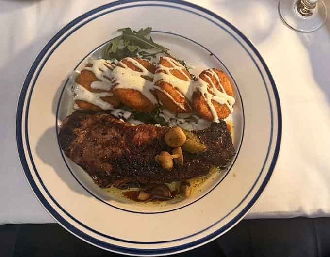 That perfectly seared steak with hasselback sweet potato proves the kitchen knows exactly what they're doing with premium cuts.