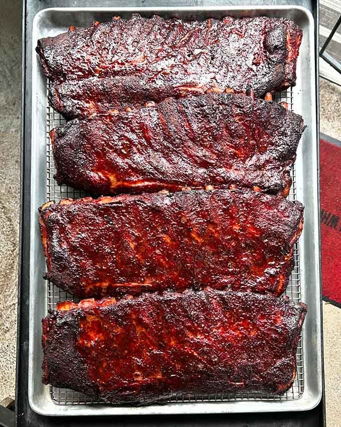 These racks of ribs look like they've been through barbecue boot camp and graduated with honors.