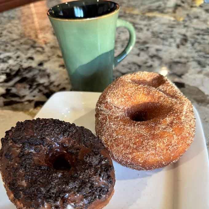 Two perfect specimens proving that sometimes the simplest pleasures, a great donut and coffee, are all you really need.