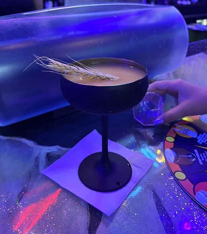 The Mango Lasso arrives looking like something a mad scientist would serve at a very festive experiment.