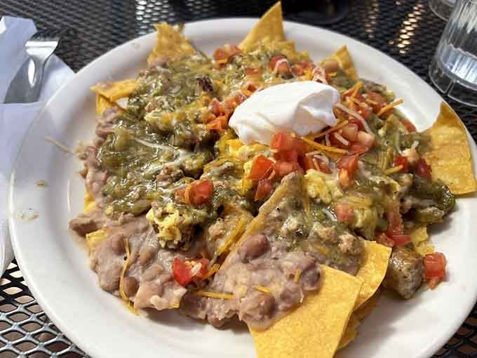 Breakfast nachos piled high with all the good stuff, because sometimes chips for breakfast is genius.