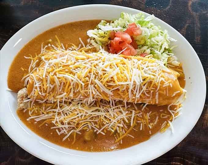 That blanket of melted cheese over your smothered burrito is basically a warm hug for breakfast.