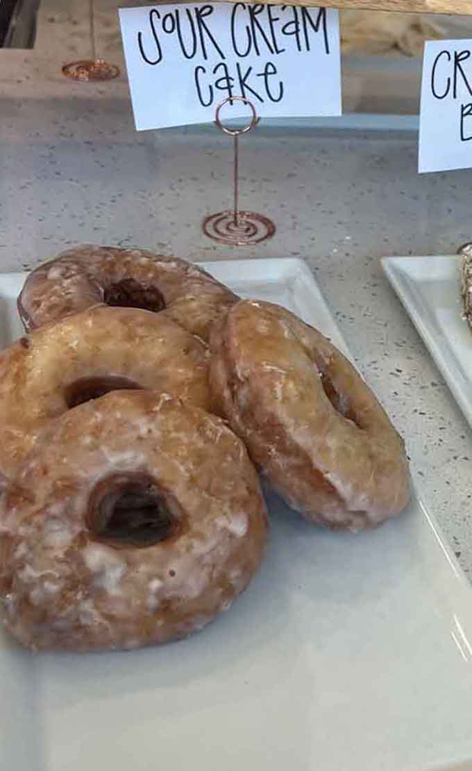 Sour cream cake donuts with that perfect golden glaze are basically edible happiness on a plate.