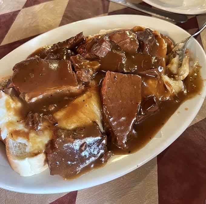 This roast beef Manhattan drowning in gravy is comfort food that could make a grown person weep with joy.