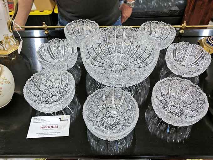 Cut crystal bowls that catch light like frozen fireworks, perfect for fancy fruit or hiding your car keys.