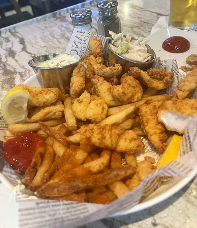 Golden fried perfection meets crispy fries in this seafood basket that'll make you forget your diet ever existed.