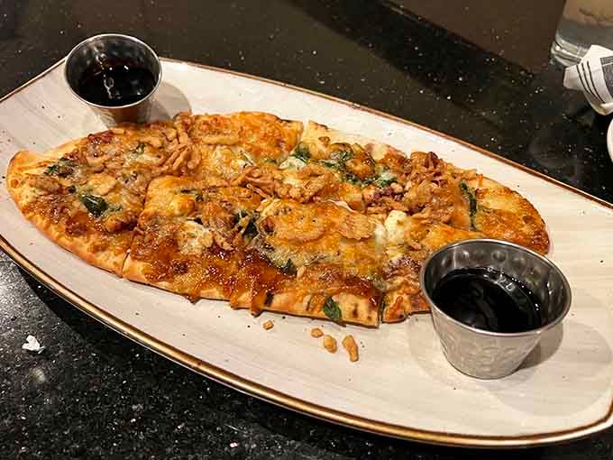 Behold the star of the show: fire-roasted flatbread with perfectly charred edges that would make any pizza jealous.