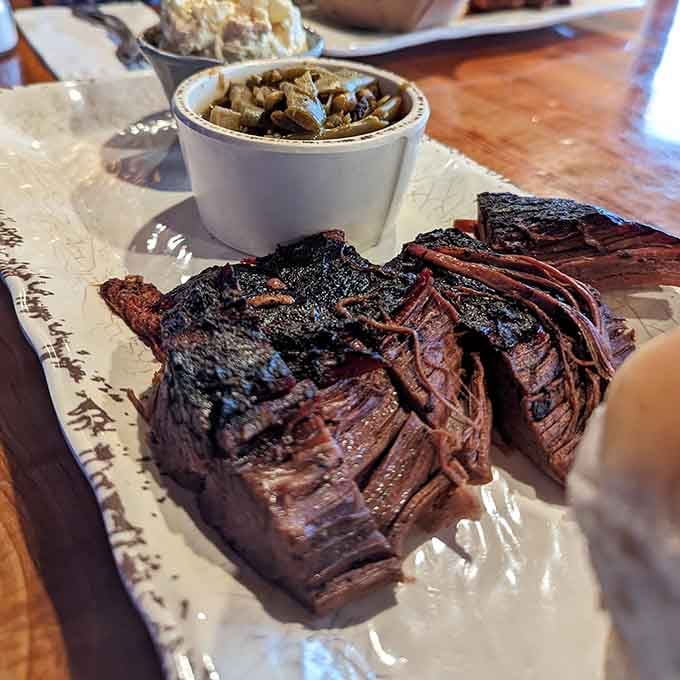 That bark and smoke ring aren't just pretty; they're proof someone spent hours perfecting your lunch.