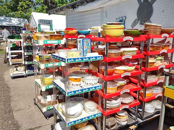Vintage dishware stacked on red metal shelves, waiting to complete your grandmother's missing collection or start your own.