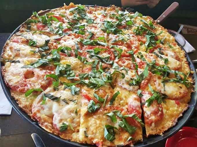 This Margherita pizza topped with fresh basil proves simplicity done right beats complexity done wrong every single time.