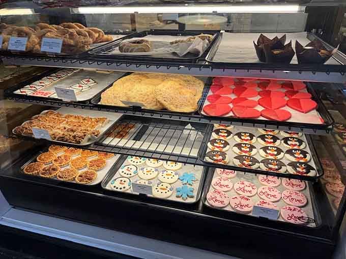 Decorated cookies lined up like sweet little soldiers, ready to brighten someone's day with pure sugary joy.
