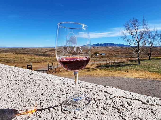 One glass of red wine with endless grassland views proves that paradise doesn't require an ocean backdrop.