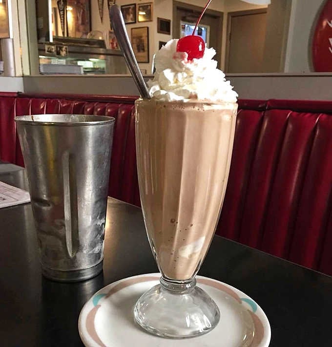 This chocolate milkshake comes with the metal cup of extra, because some traditions are too good to abandon.