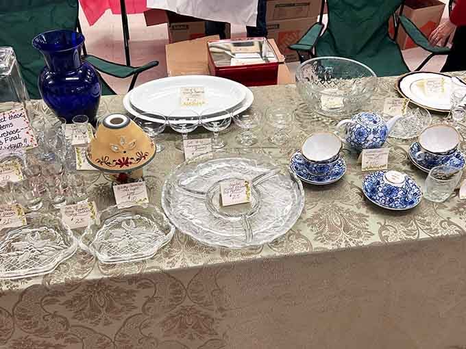 Vintage glassware catches the light like edible jewels, each piece whispering stories from dinner tables past.