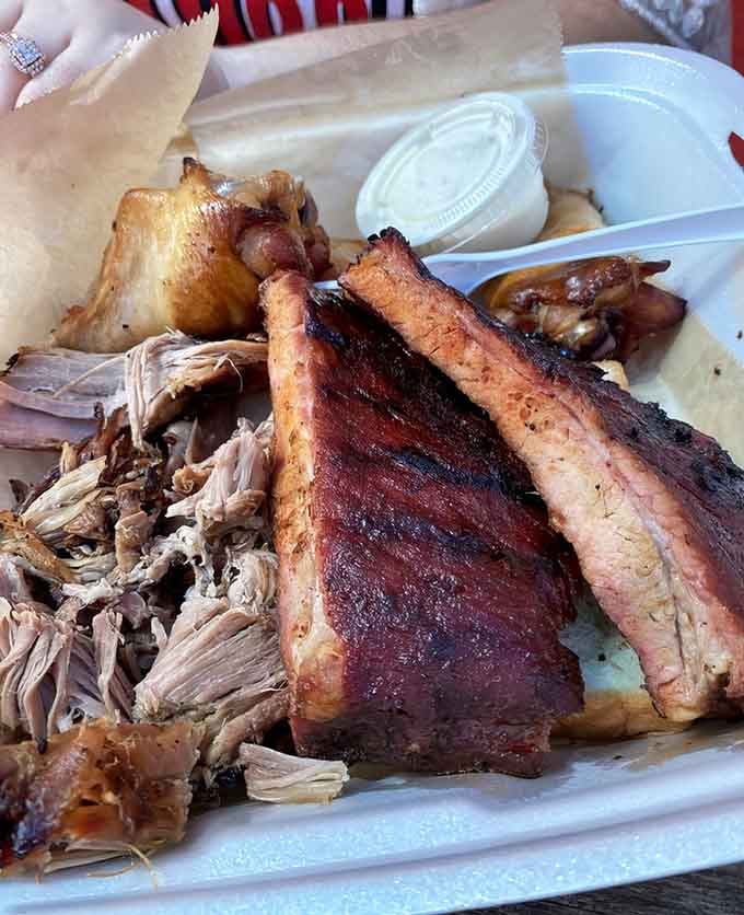 Ribs, wings, and pulled pork walk into a plate, and nobody's laughing because their mouths are too full.